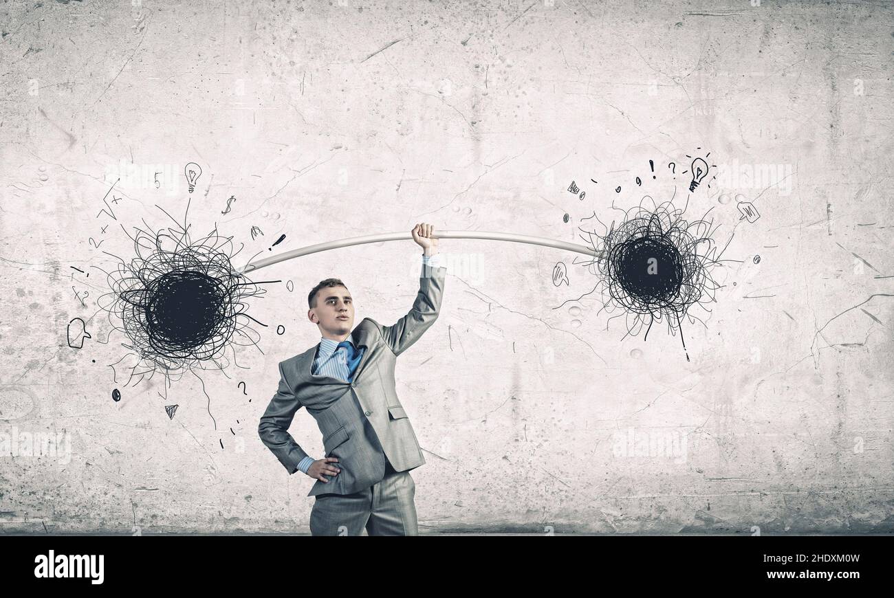 Young strong businessman lifting barbell hi-res stock photography and ...