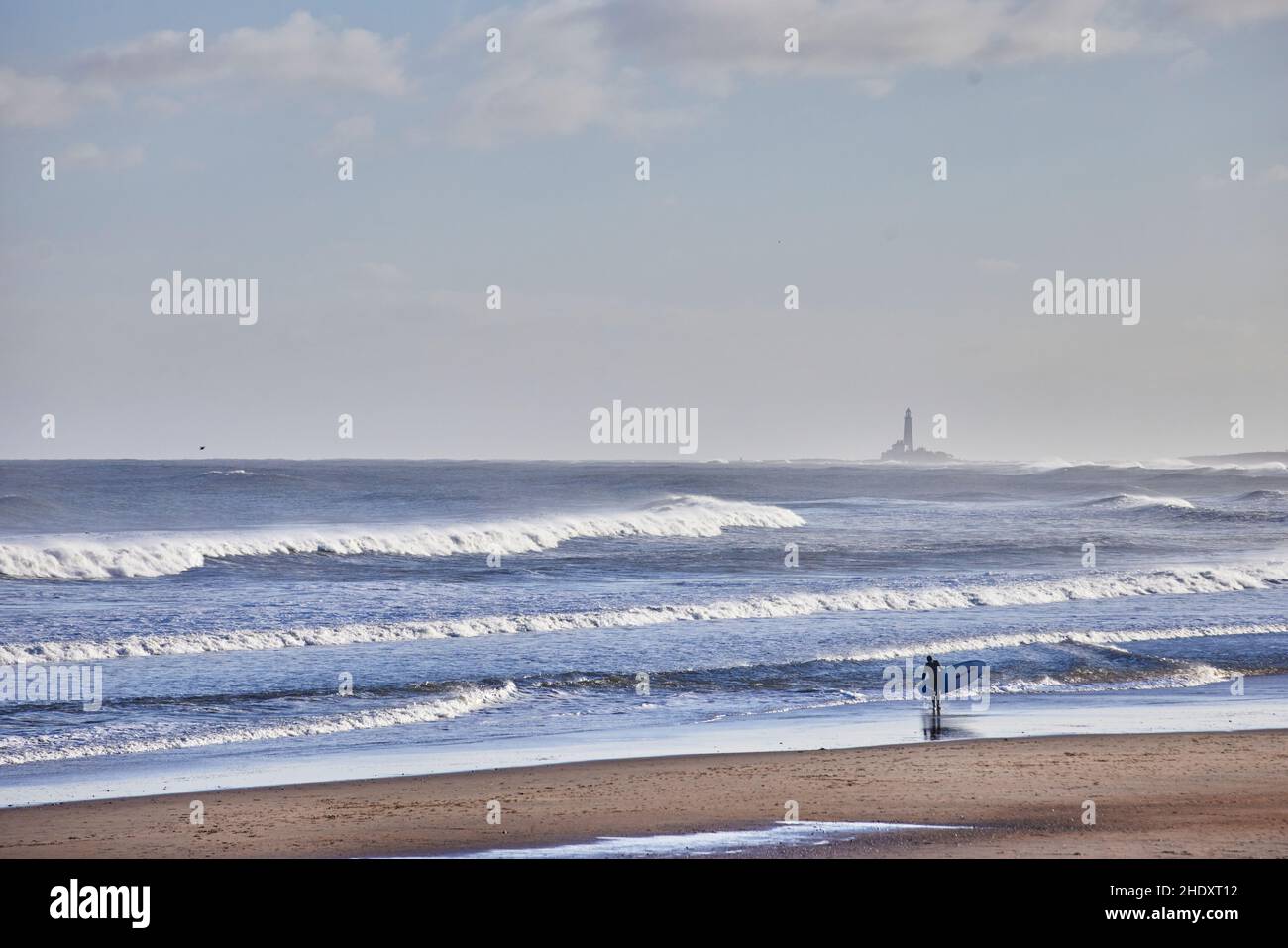 Blyth Harbour Lighthouse in North Tyneside, Tyne & Wear, surfer walking ...