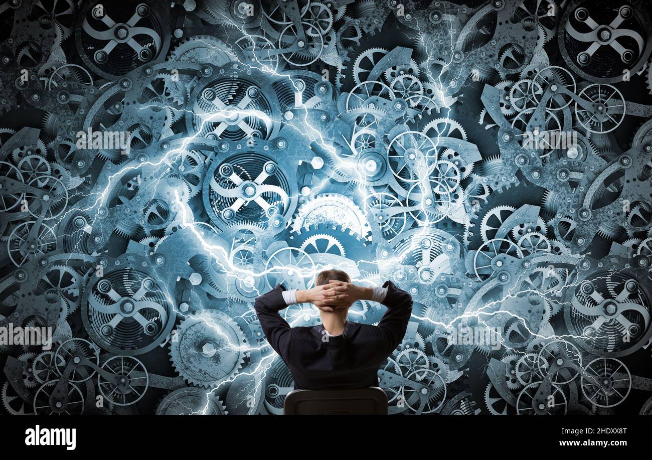 Young man watching automation machine hi-res stock photography and images - Alamy