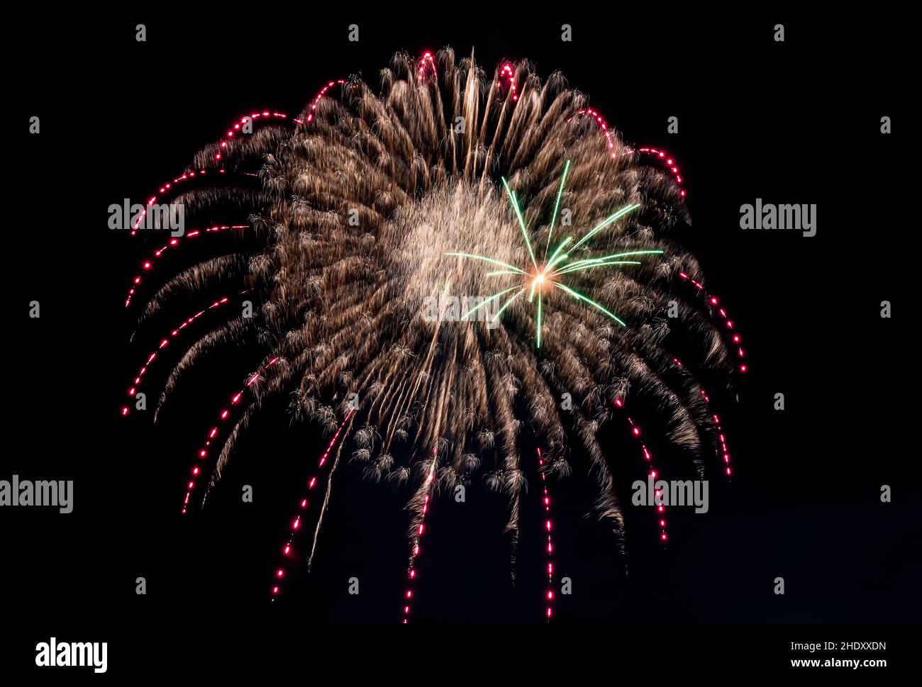 Bright rays of light from explosion of festive fireworks against black ...