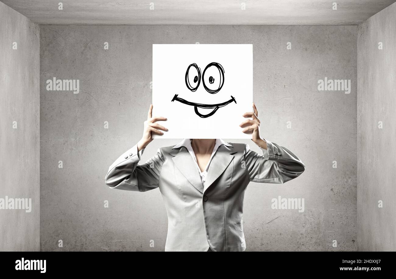 hiding, smiley, positive, hide, smiley faces, positives Stock Photo - Alamy
