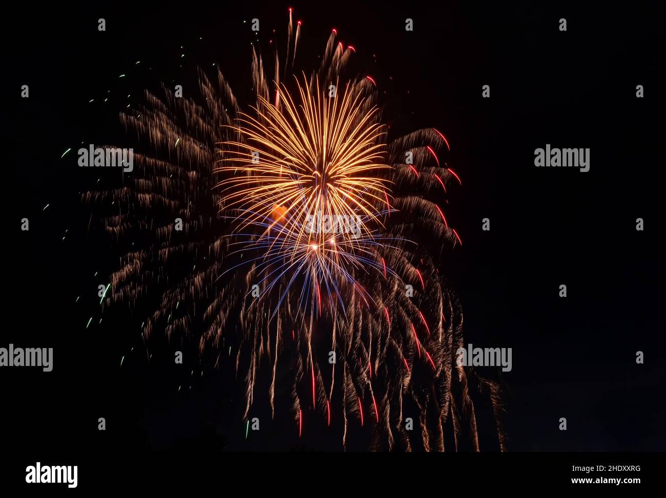 Bright rays of light from explosion of festive fireworks against black ...