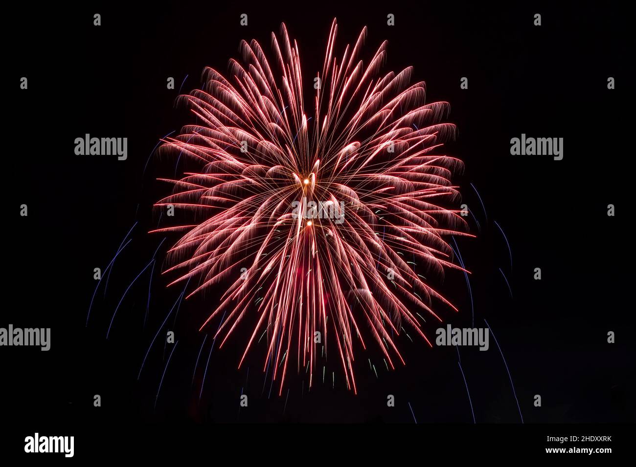 Bright rays of light from explosion of festive fireworks against black ...