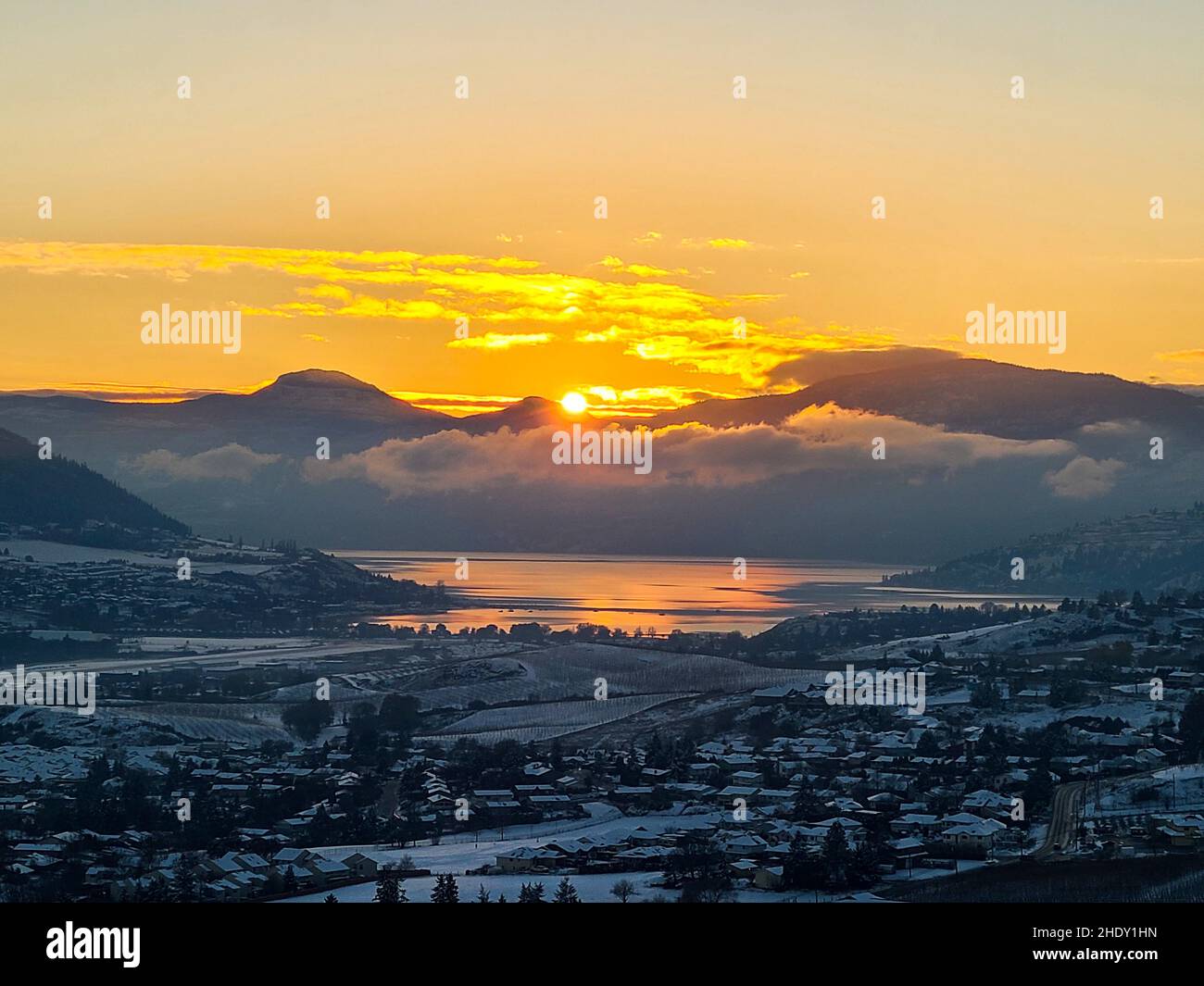 Sunset behind mountain Stock Photo - Alamy