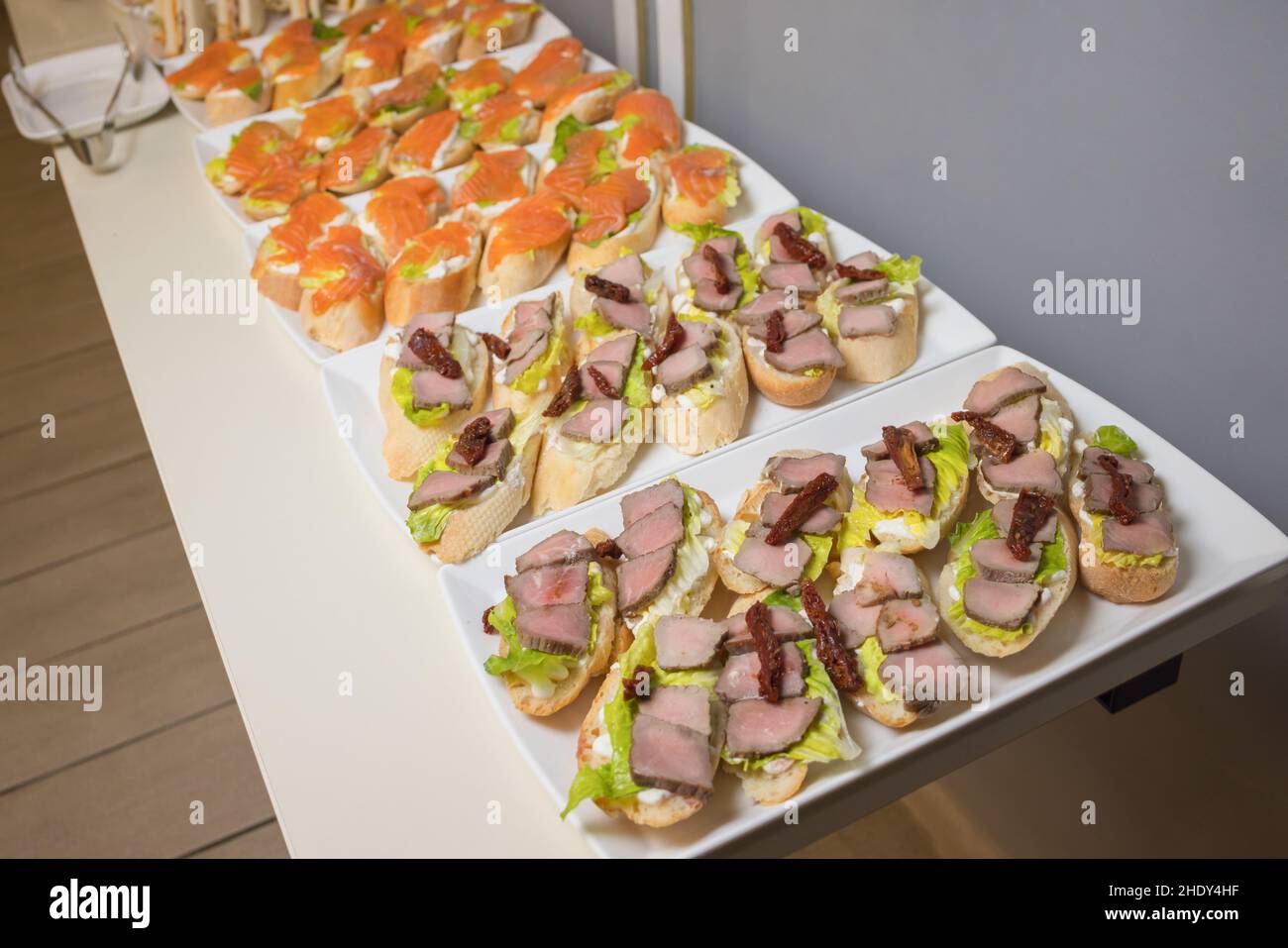 Plate of many mini bite size quiche appetizers Stock Photo - Alamy