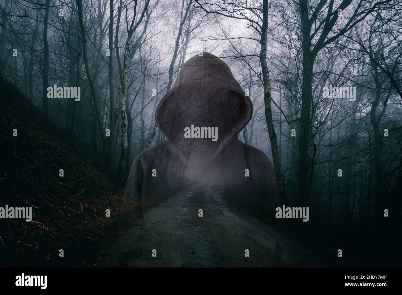 A horror concept of a double exposure of a scary hooded figure with no ...