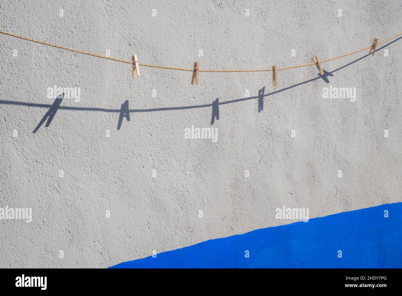 Clothes pegs on the rope Stock Photo - Alamy