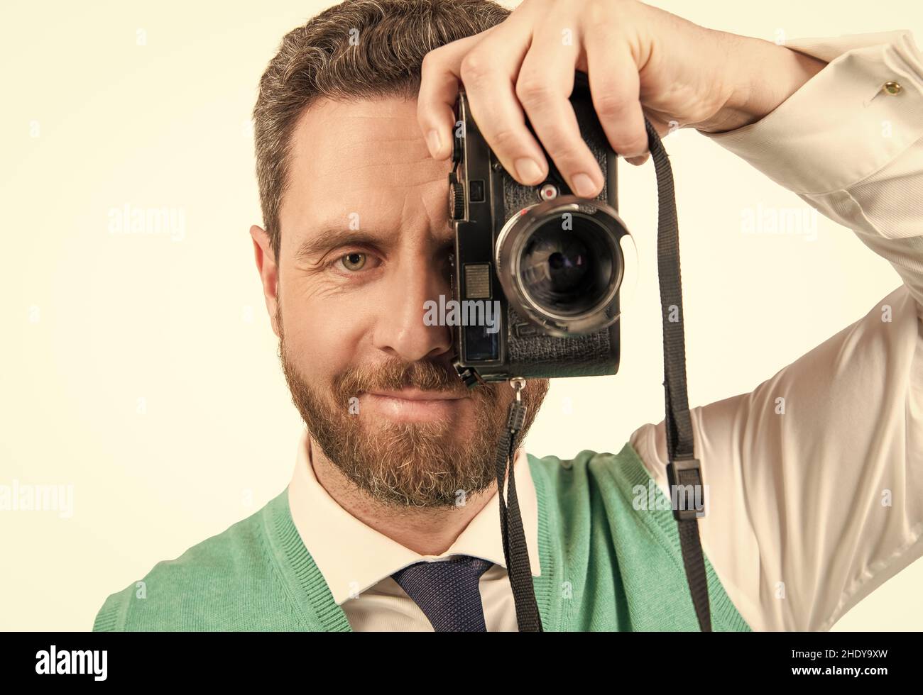 guy taking camera with retro camera isolated on white backdrop, copy ...