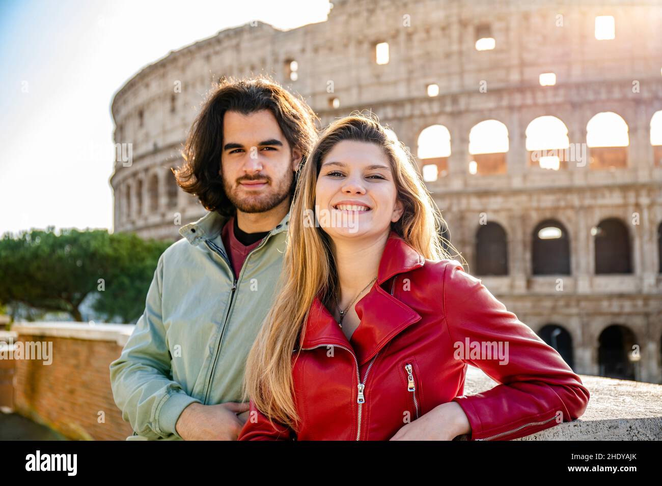 Young couple traveling to Rome. The couple is posing for a photo in ...