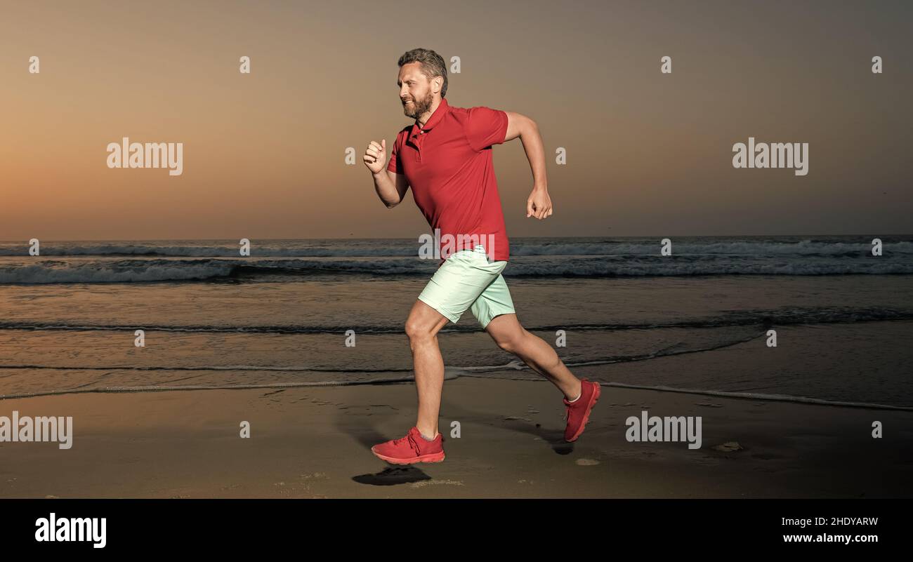 sportsman sprinter running on sunrise summer beach at ocean, athlete ...
