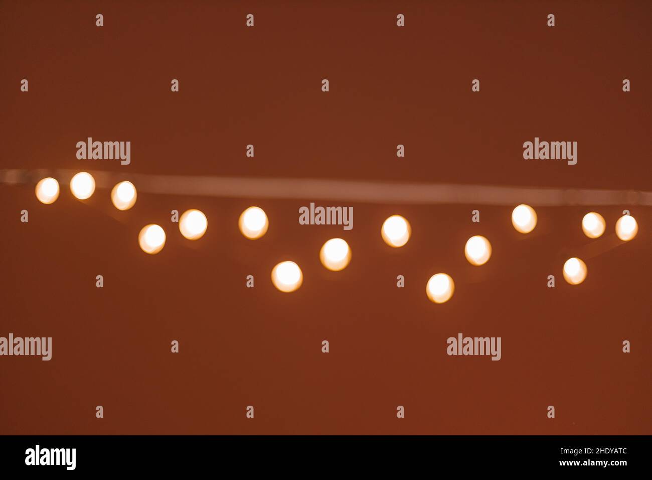 Colorful festive christmas lights holiday background, bright light bulb ...