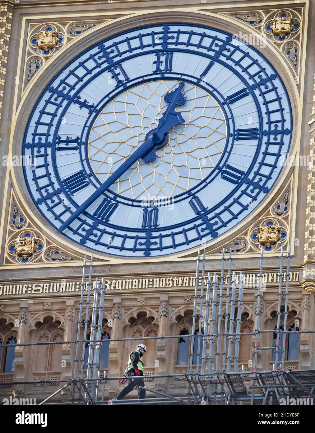 Construction Workers remove scaffolding from the clock face of ...