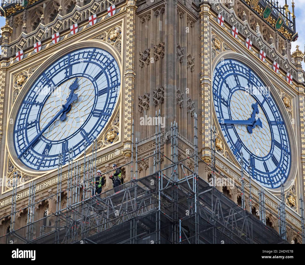 Construction Workers remove scaffolding from the clock face of ...
