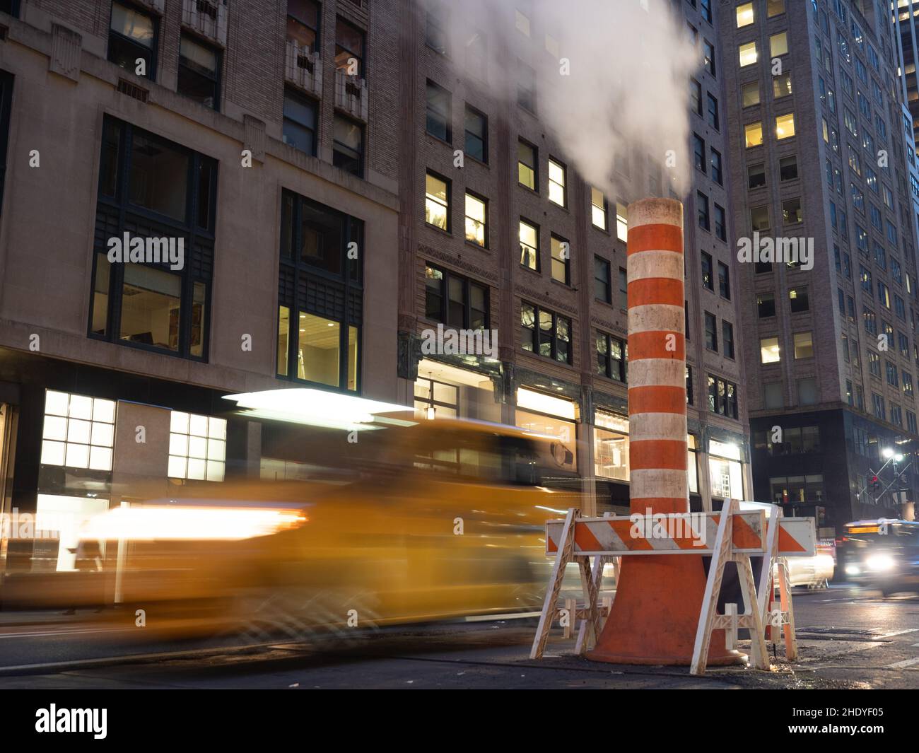 Long exposure image of a cab and a steam stack on Madison Avenue Stock ...