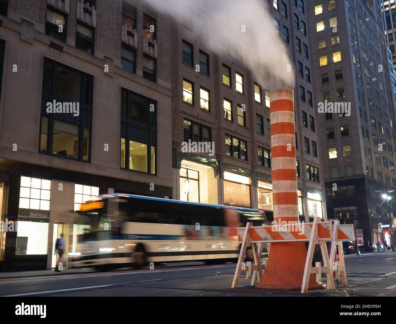 Long exposure image of a bus and a steam stack near Madison Avenue, New ...
