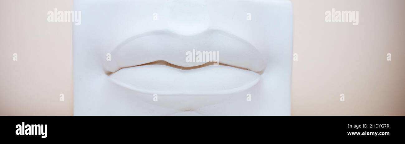 Lips plaster casting in a sculpting studio used for clay modelling ...