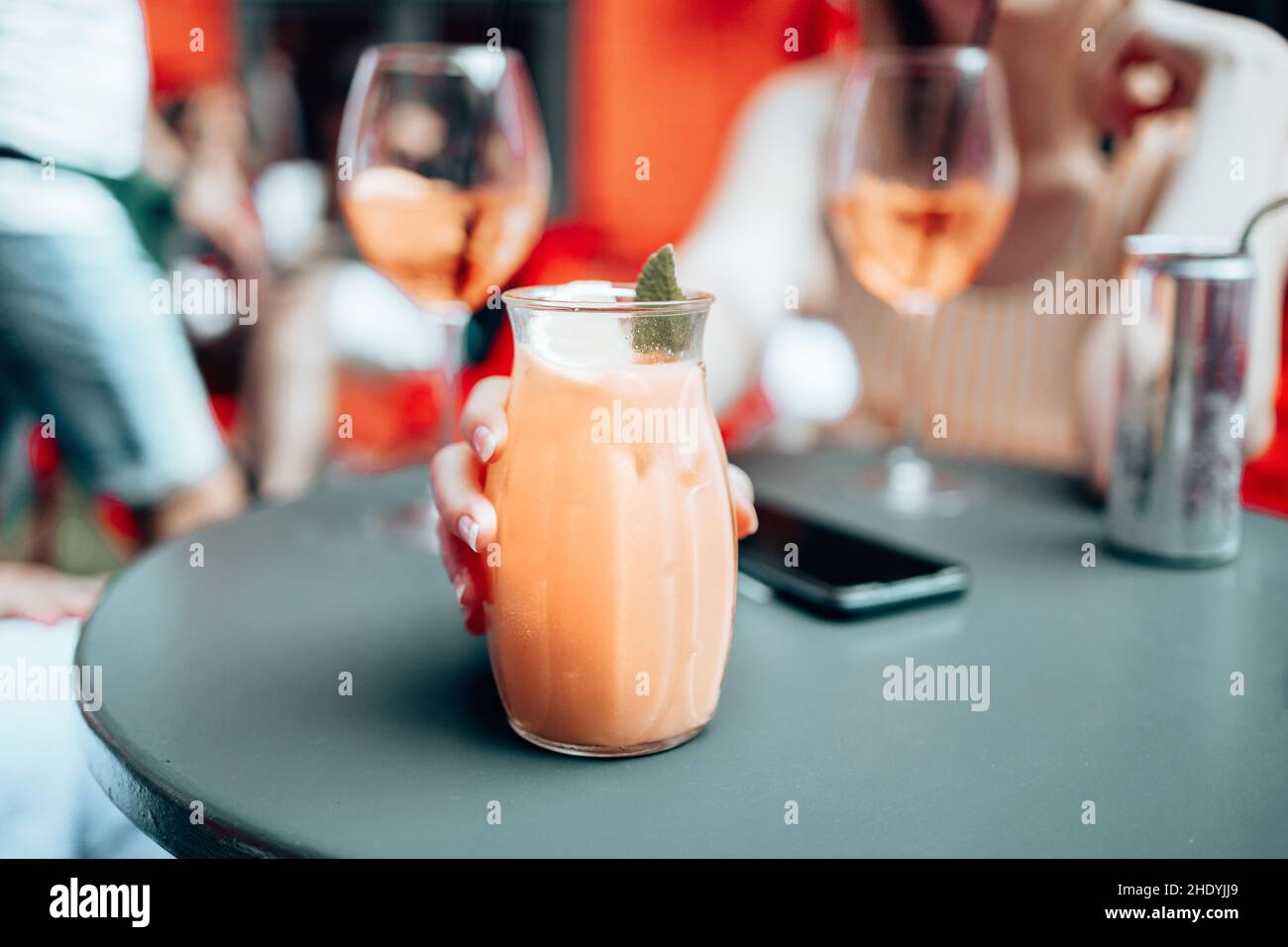 Woman hand with classic alcohol cocktail making toast Stock Photo - Alamy