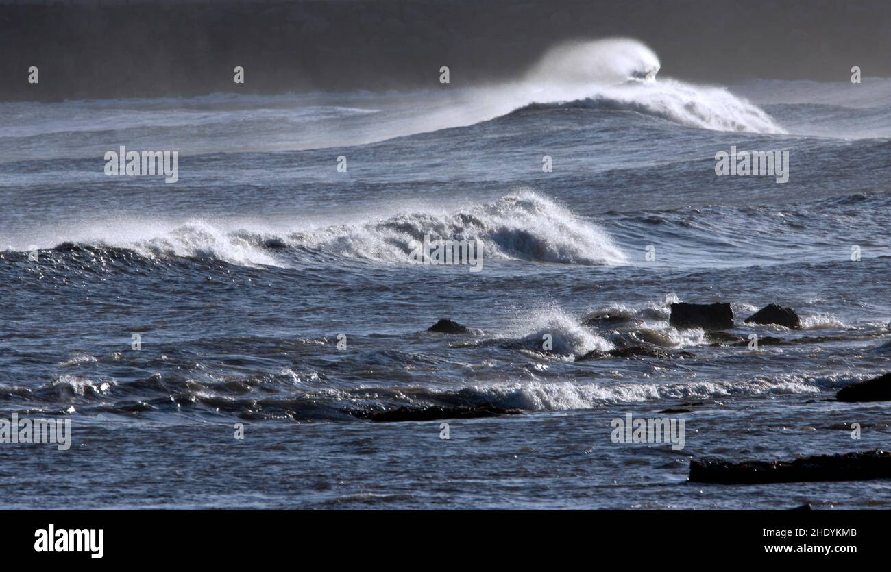 Breakers roll in from the North Sea after a winters gale. Waves such as ...