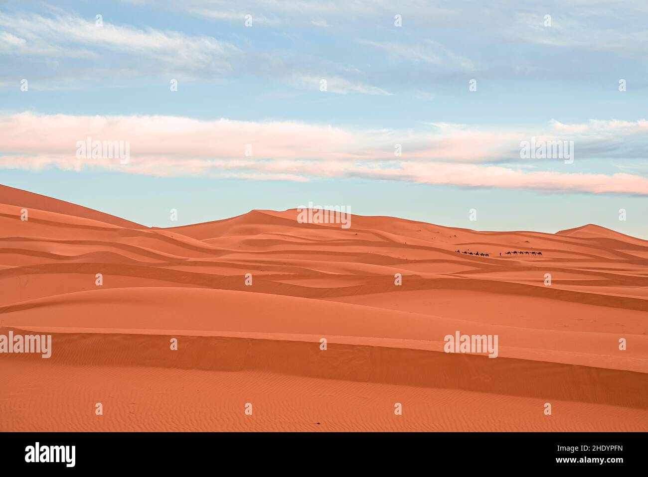 Amazing view of sand dunes with waves pattern in desert against cloudy ...