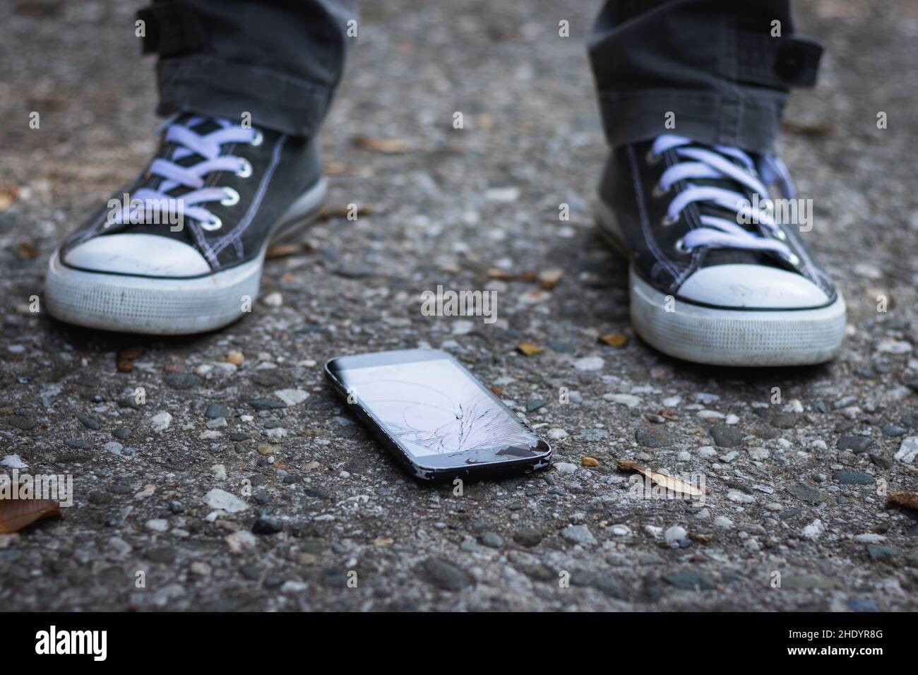 Smart phone with a cracked screen hi-res stock photography and images ...
