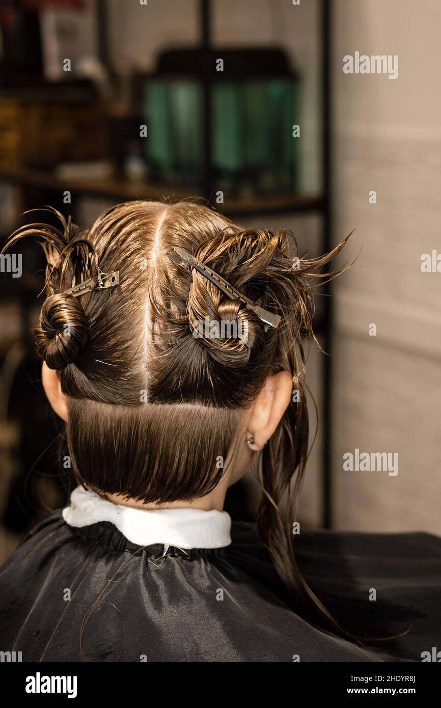 Close Up Back View of Little Girl Client. Hairtician Divided Hair in ...