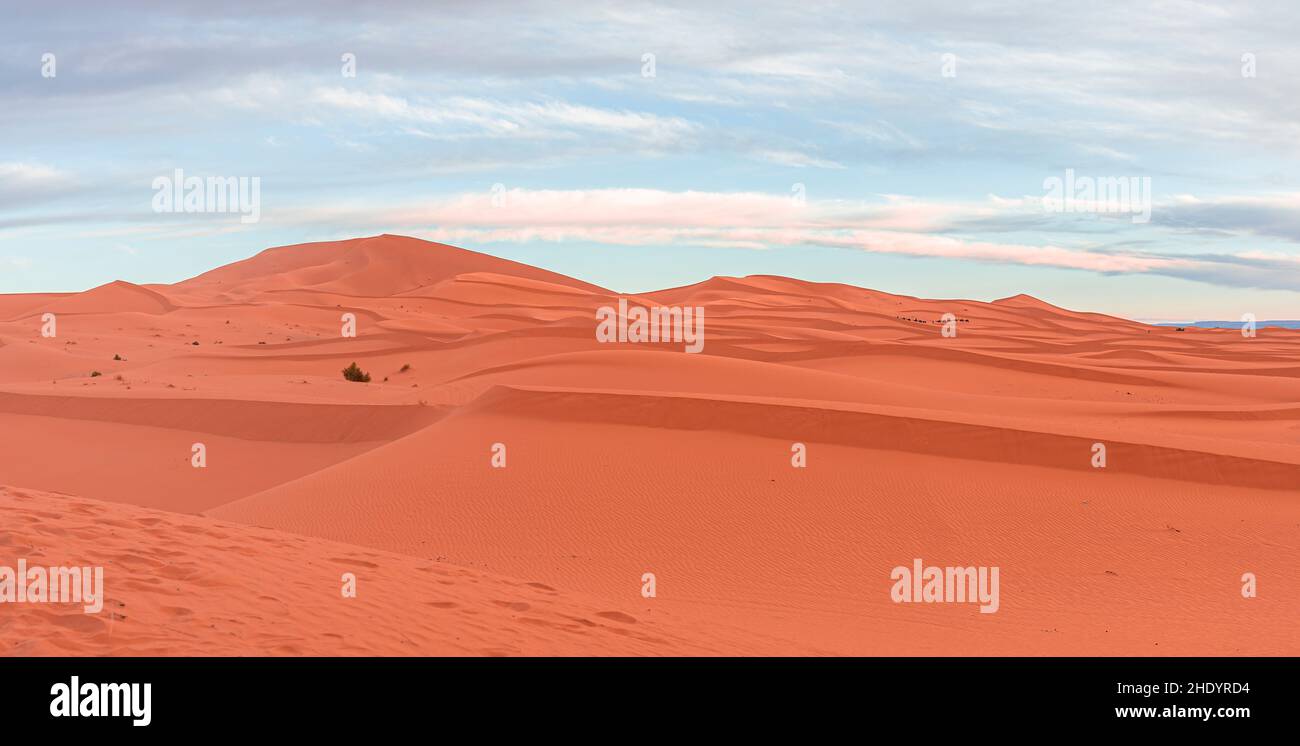 Amazing view of sand dunes with waves pattern in desert against cloudy ...