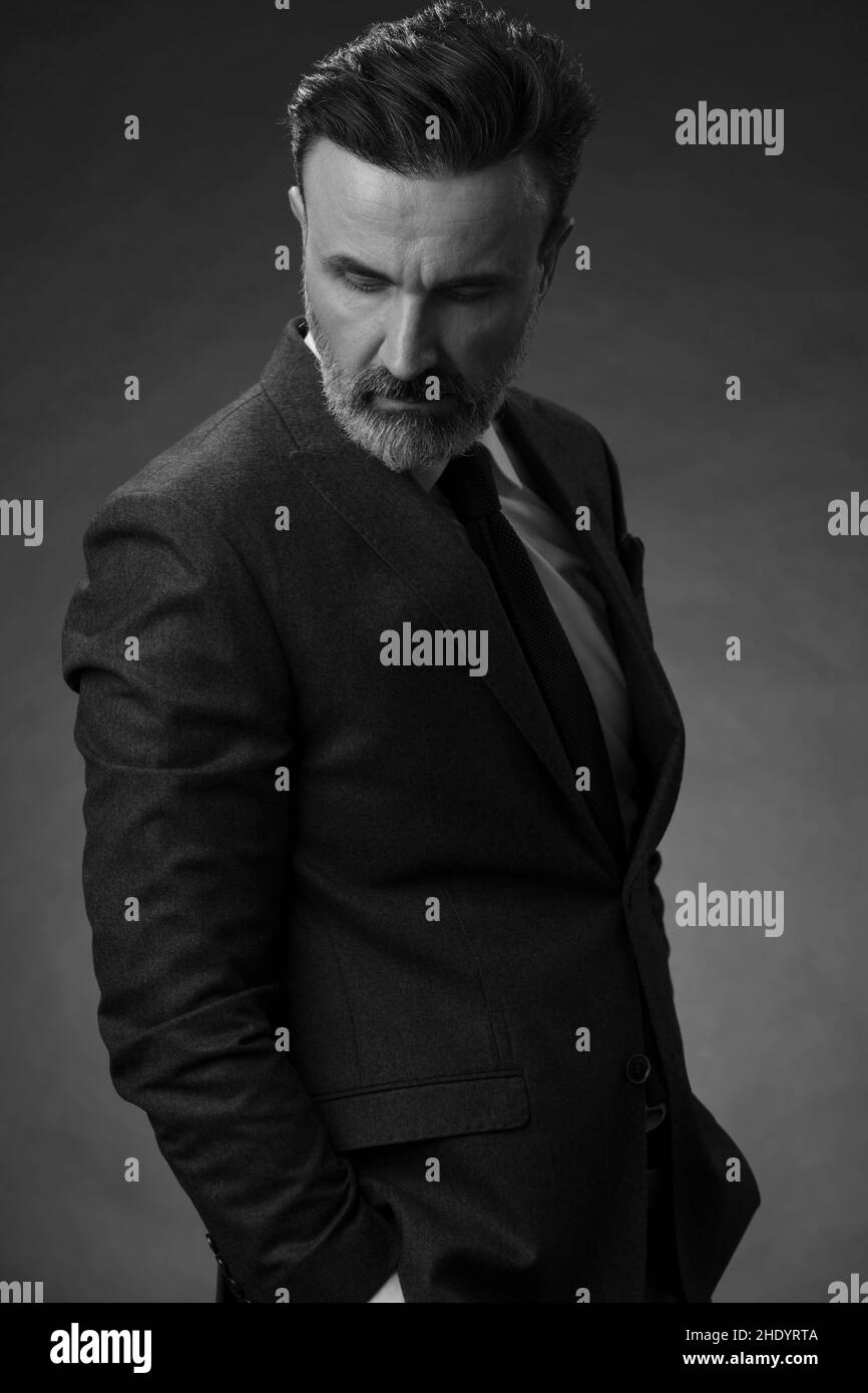 Grey background handsome businessman Black and White Stock Photos ...