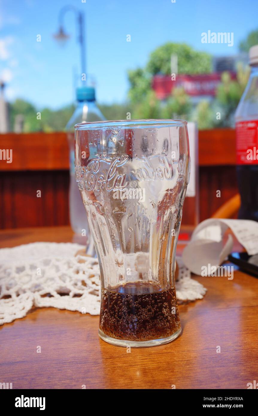 Glass of Coca Cola on a table Stock Photo - Alamy