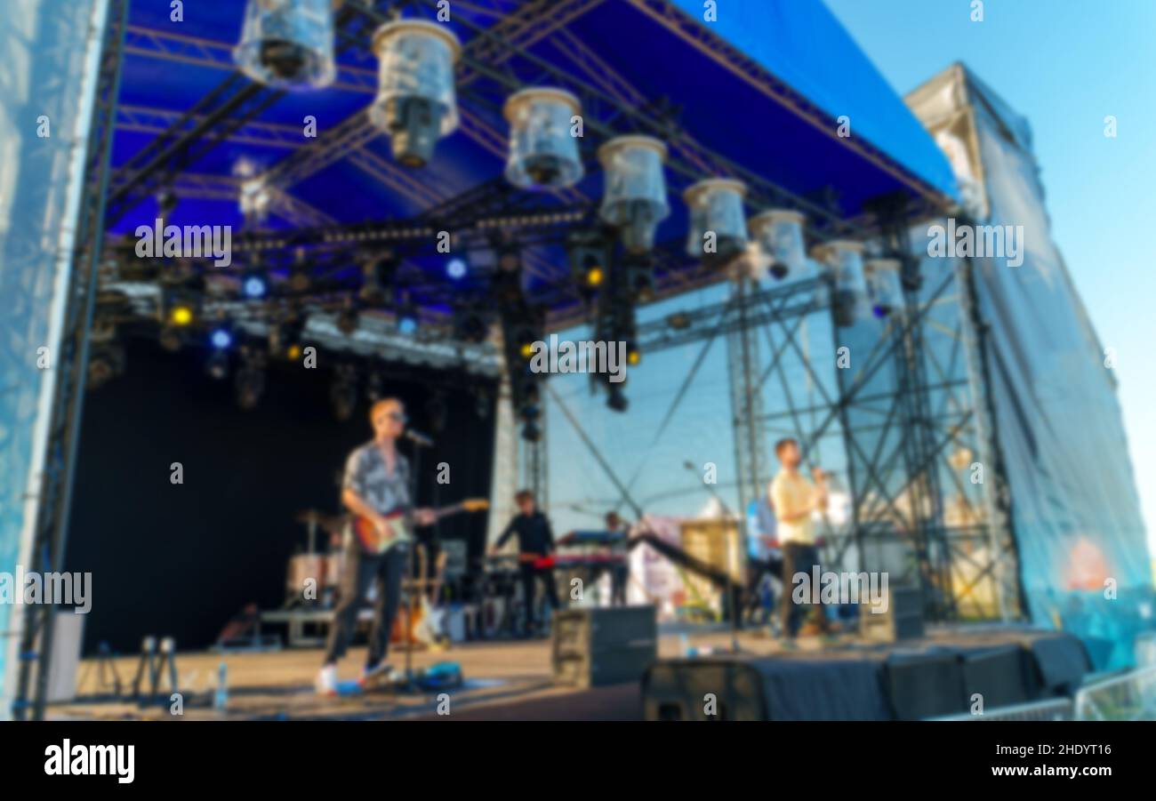 Musical band performing live on the stage. Blurred image Stock Photo ...