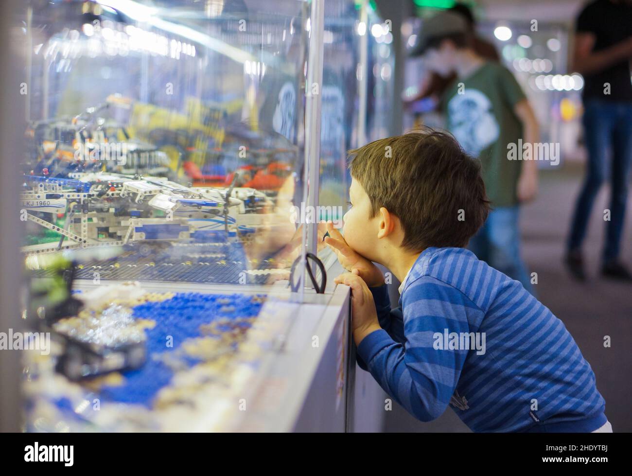 Boy looking at Lego bricks Stock Photo - Alamy
