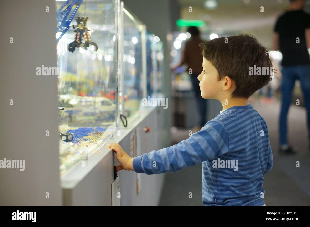 Boy looking at Lego bricks Stock Photo - Alamy