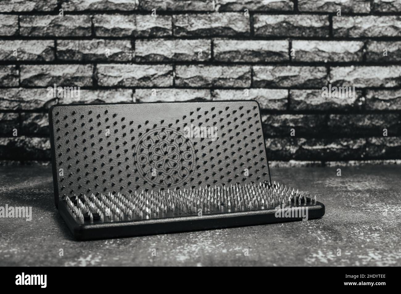 The concept of meditation, standing on nails, therapy Stock Photo - Alamy