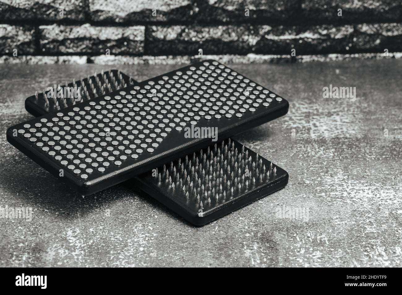 The concept of meditation, standing on nails, therapy Stock Photo - Alamy