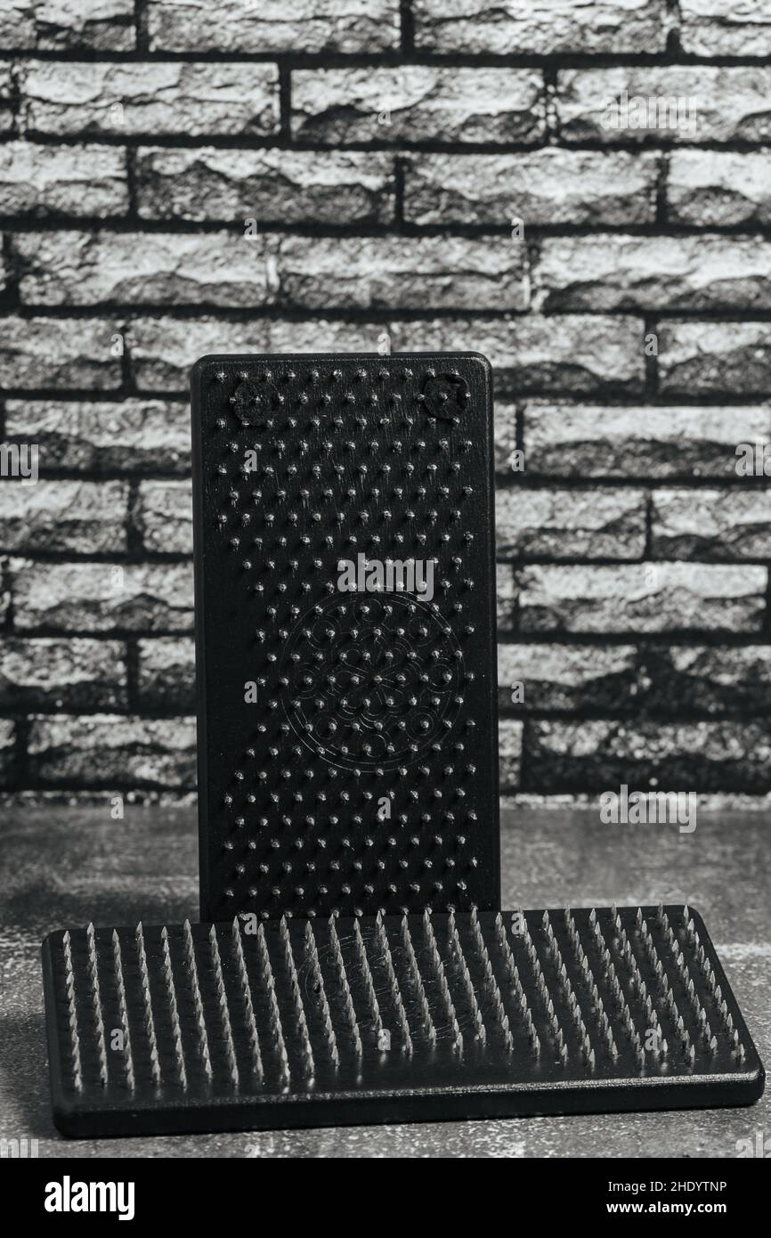 The concept of meditation, standing on nails, therapy Stock Photo - Alamy