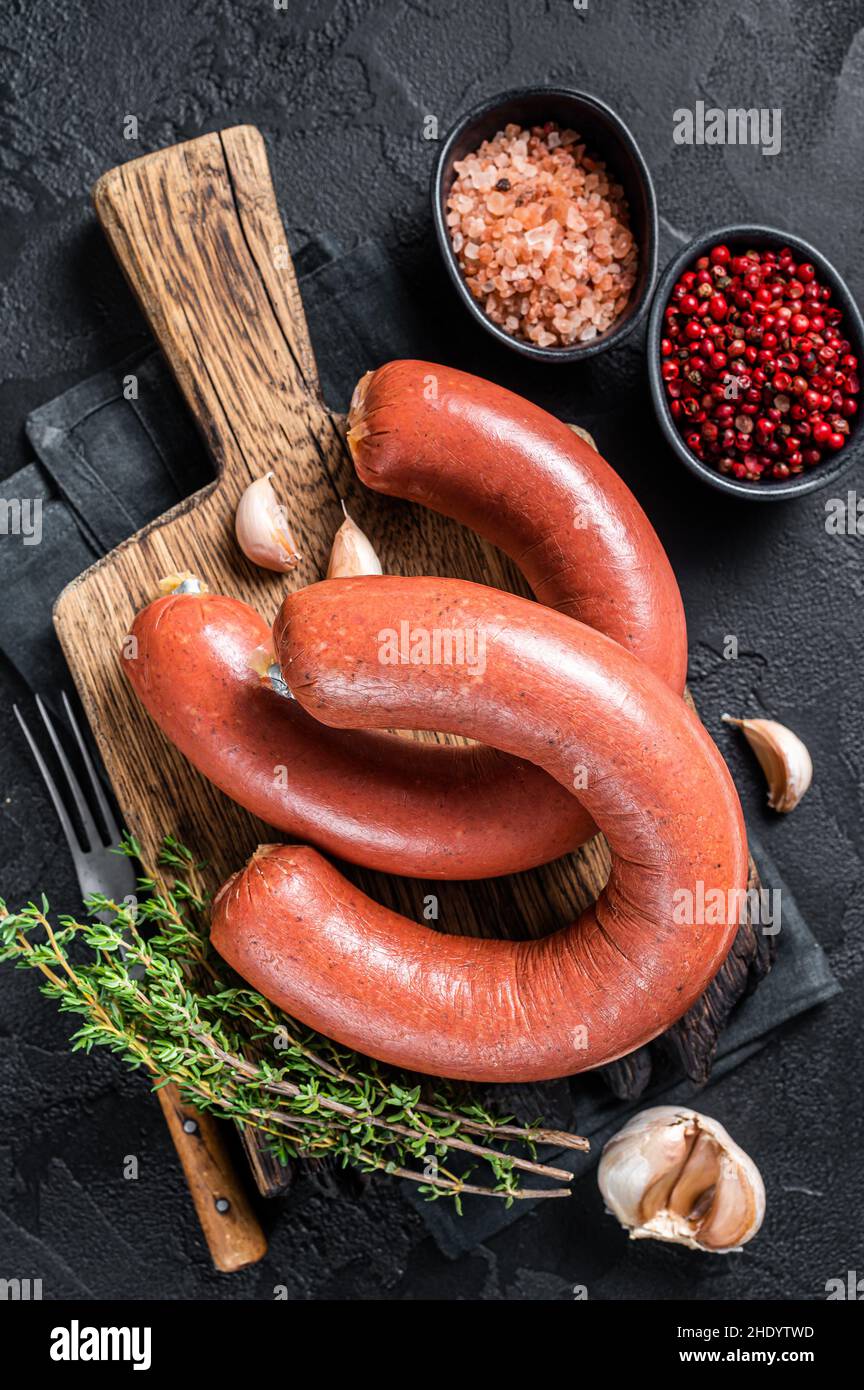 Sucuk meat sausage, Sujuk dry spicy sausage. Black background. Top view ...