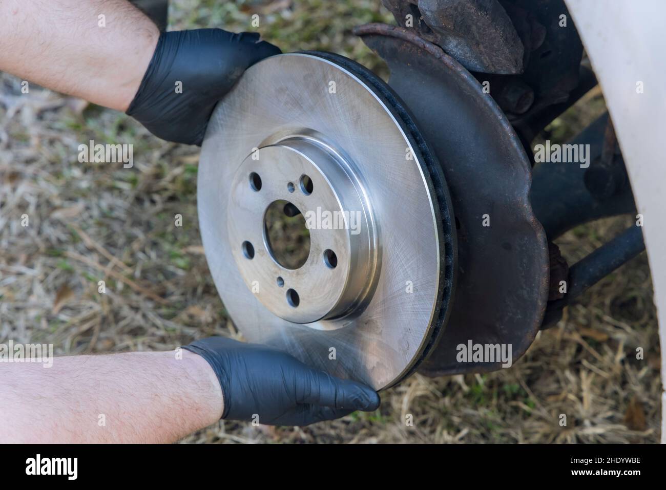 Car repair wheel hub of an old car brake pad, wheel axle Stock Photo ...