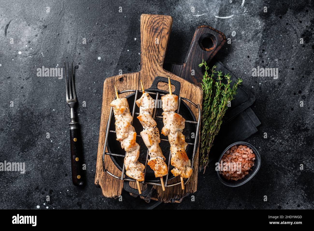 Grilled Chicken skewers souvlaki, poultry meat shish kebab. Black background. Top view Stock ...