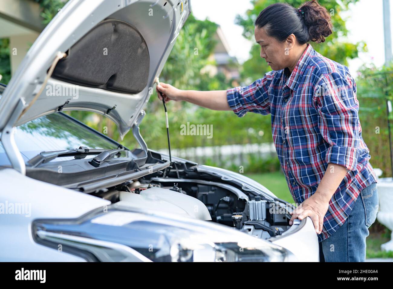 Open hood mechanic engine system to check and repair damage car crash ...