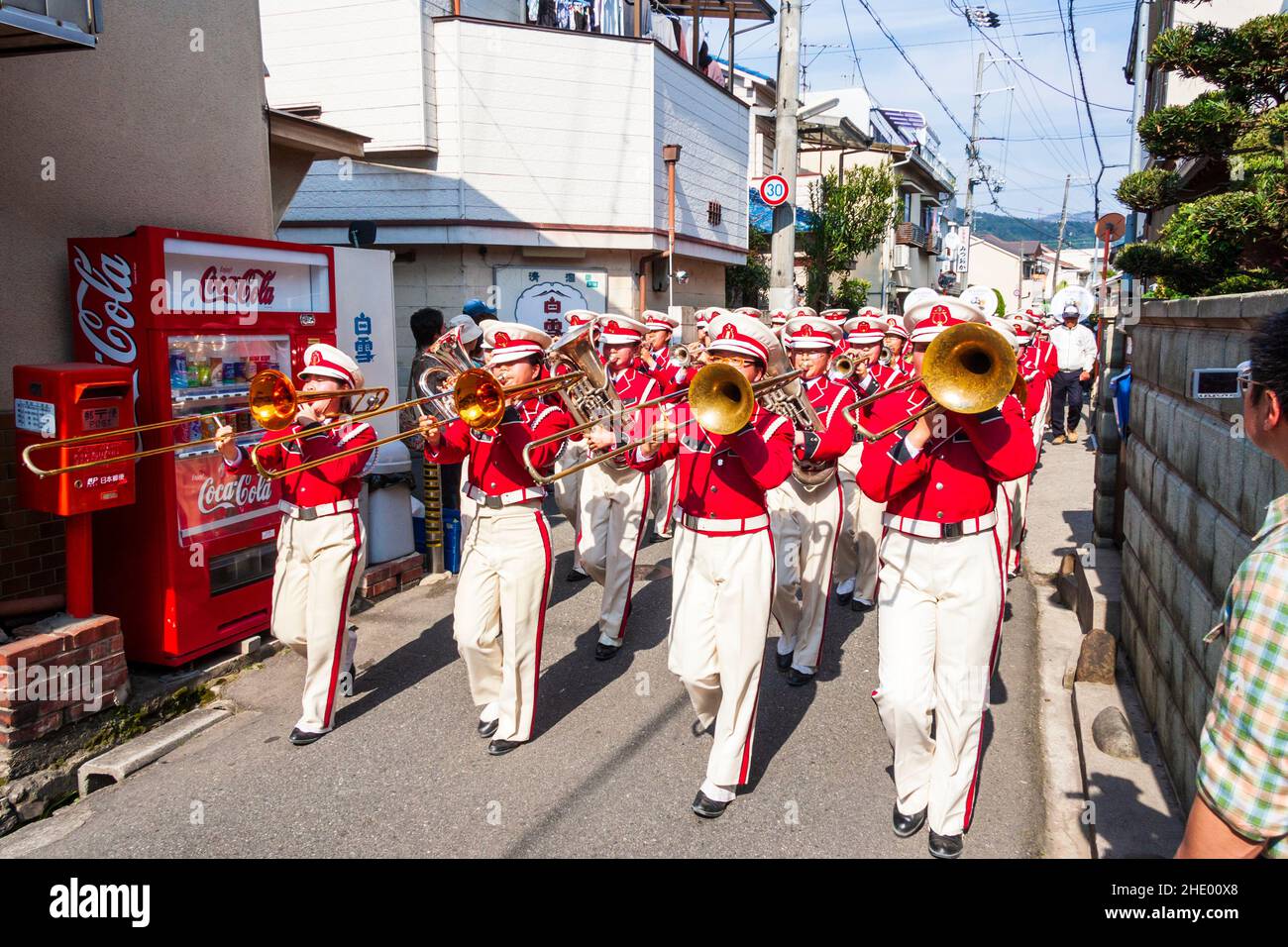 Japanese teenage Waseda Band, in pink and white military style uniforms ...