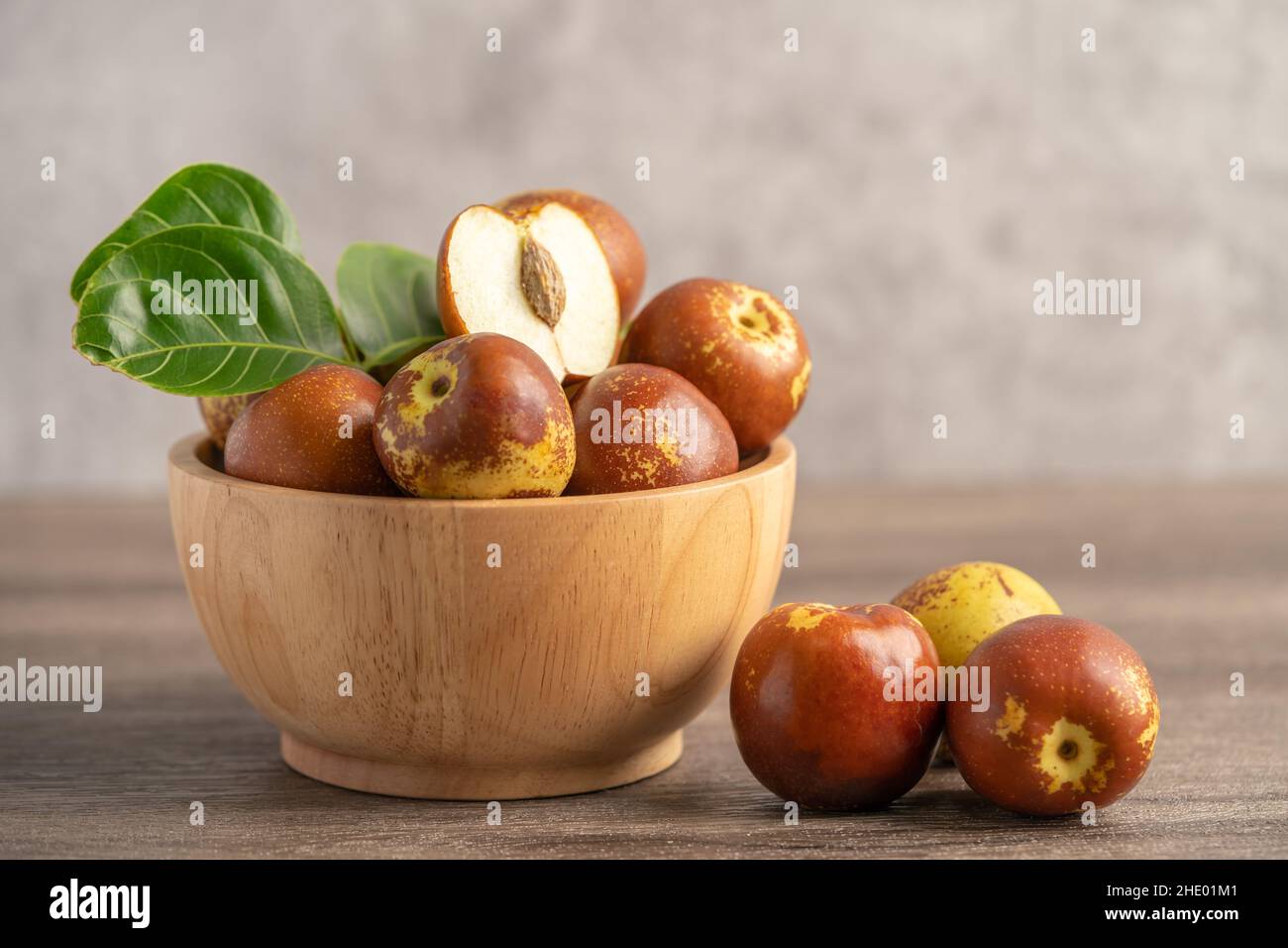 Jujube fruit or Chinese Dates in wooden bowl, healthy food Stock Photo ...