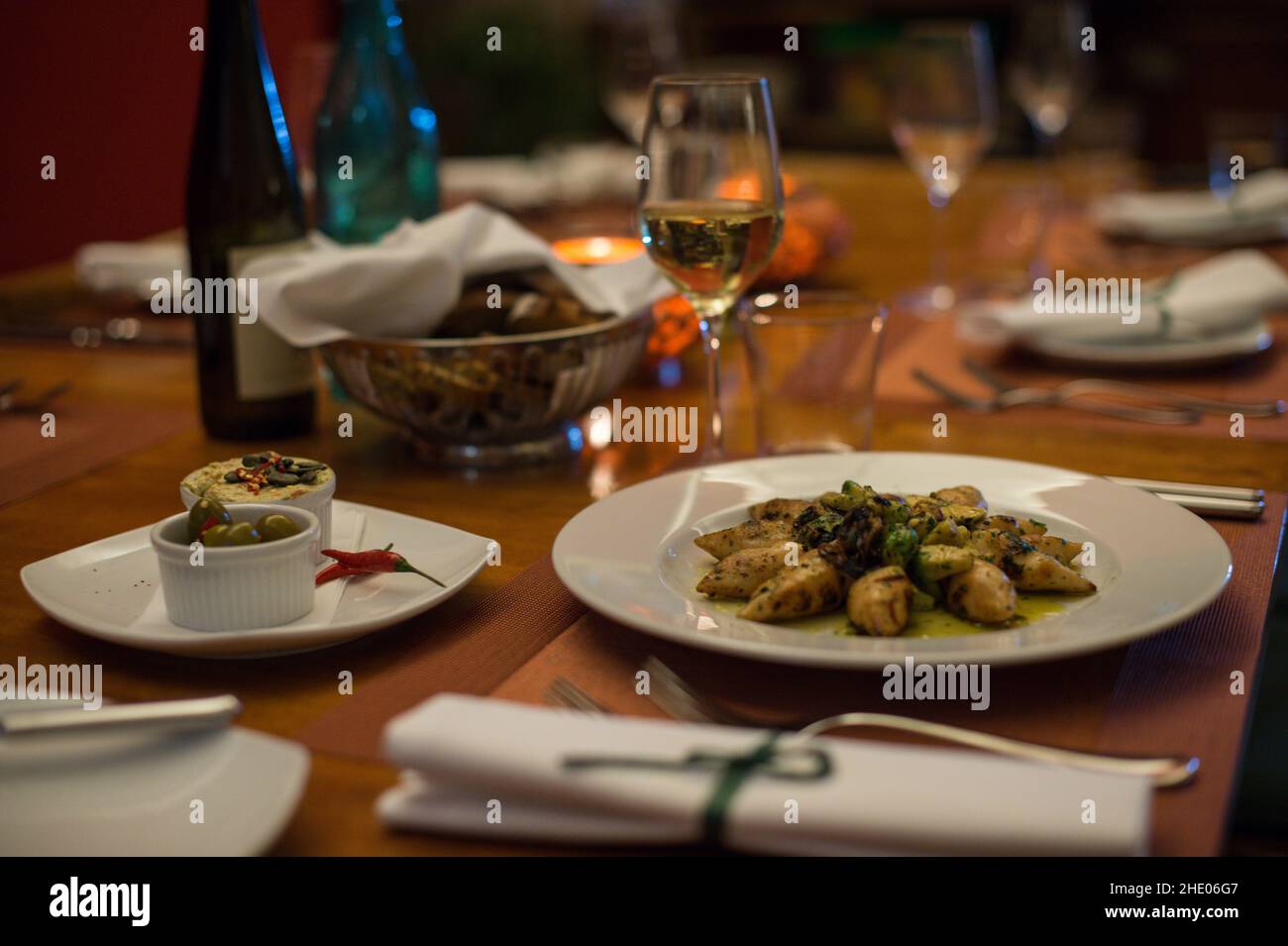 A wooden restaurant table is well set Stock Photo - Alamy