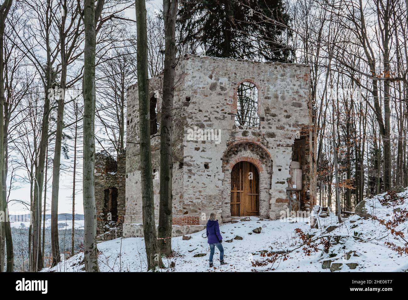 Hiking girl enjoying view of ruins of abandoned Chapel of Saint Mary ...