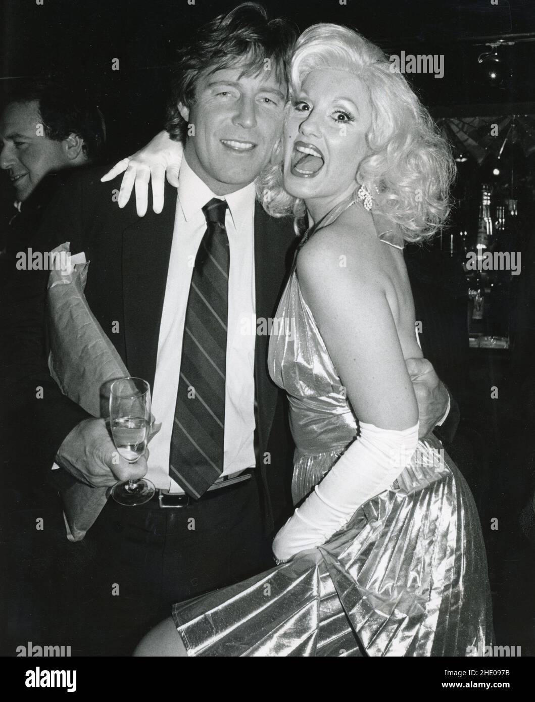 London, UK. LIBRARY. Bill Wiggins and Susie Silvey at a party in ...
