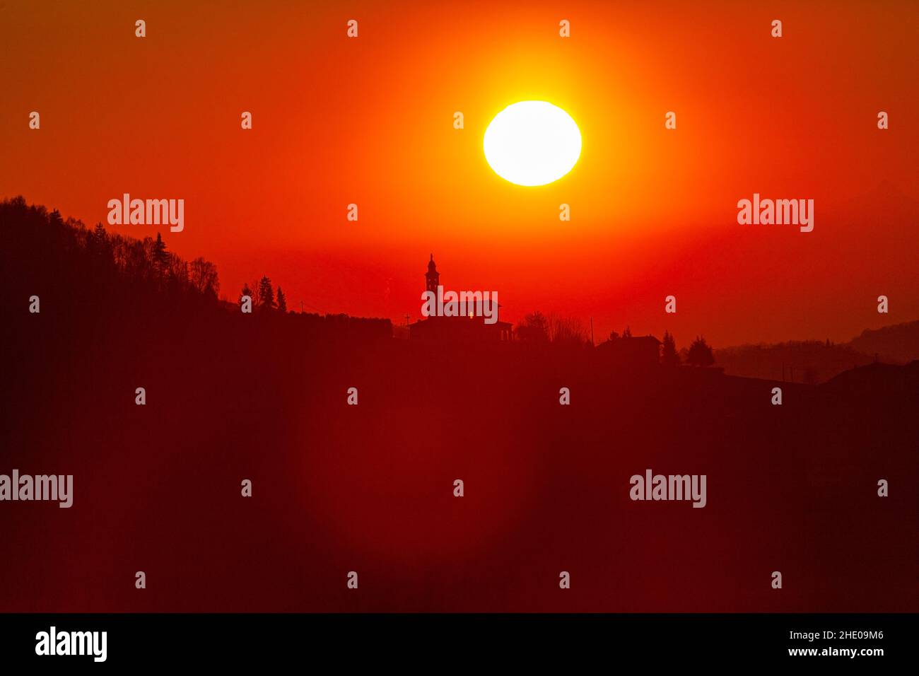 sunset behind a church on the Alps in winter time Stock Photo - Alamy
