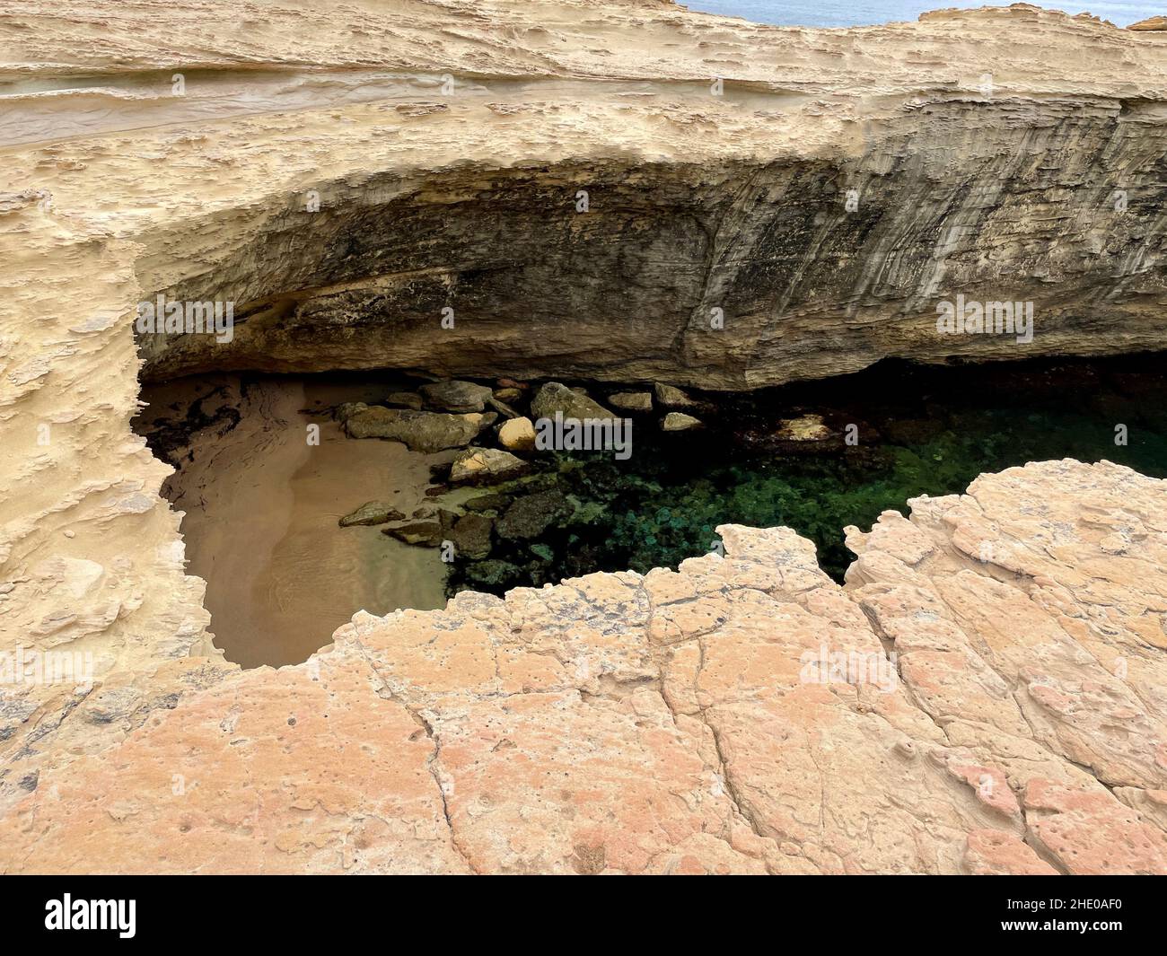 Secret sandy cave beach Saint-Antoine with turquoise water at Capo ...