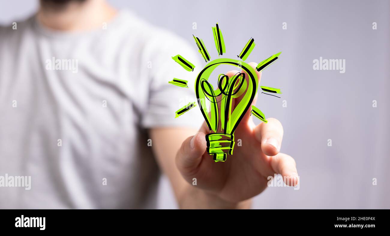 Hand tapping a digital render of illuminated green lightbulbs ...