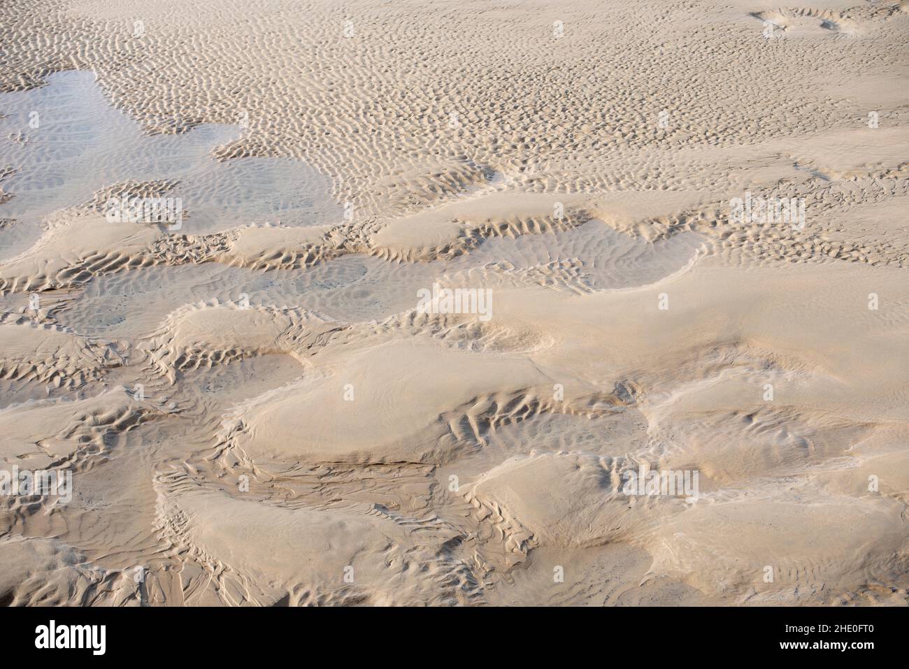 Beach sand texture eroded by water Stock Photo - Alamy