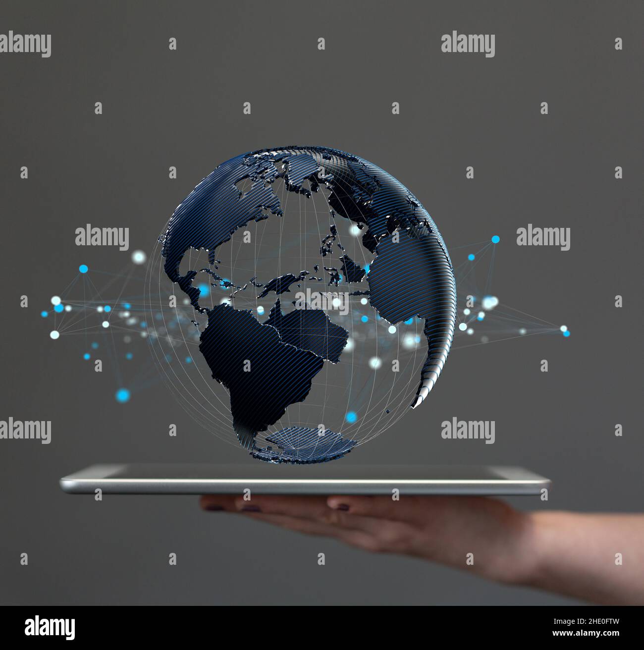 Hand holding a tablet with a floating render of a globe- global network ...