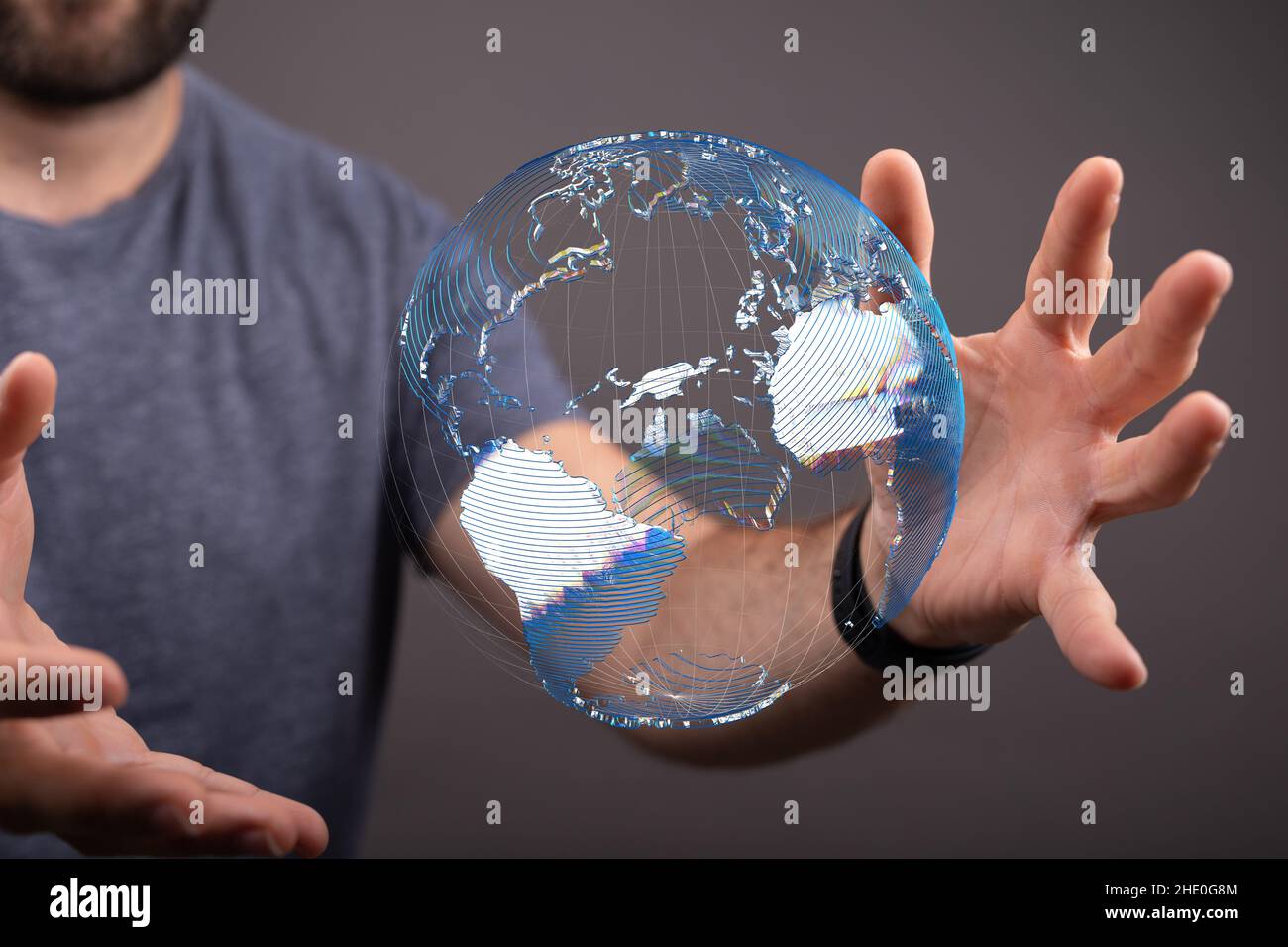 Closeup shot of a man showing the global network on the globe Stock ...