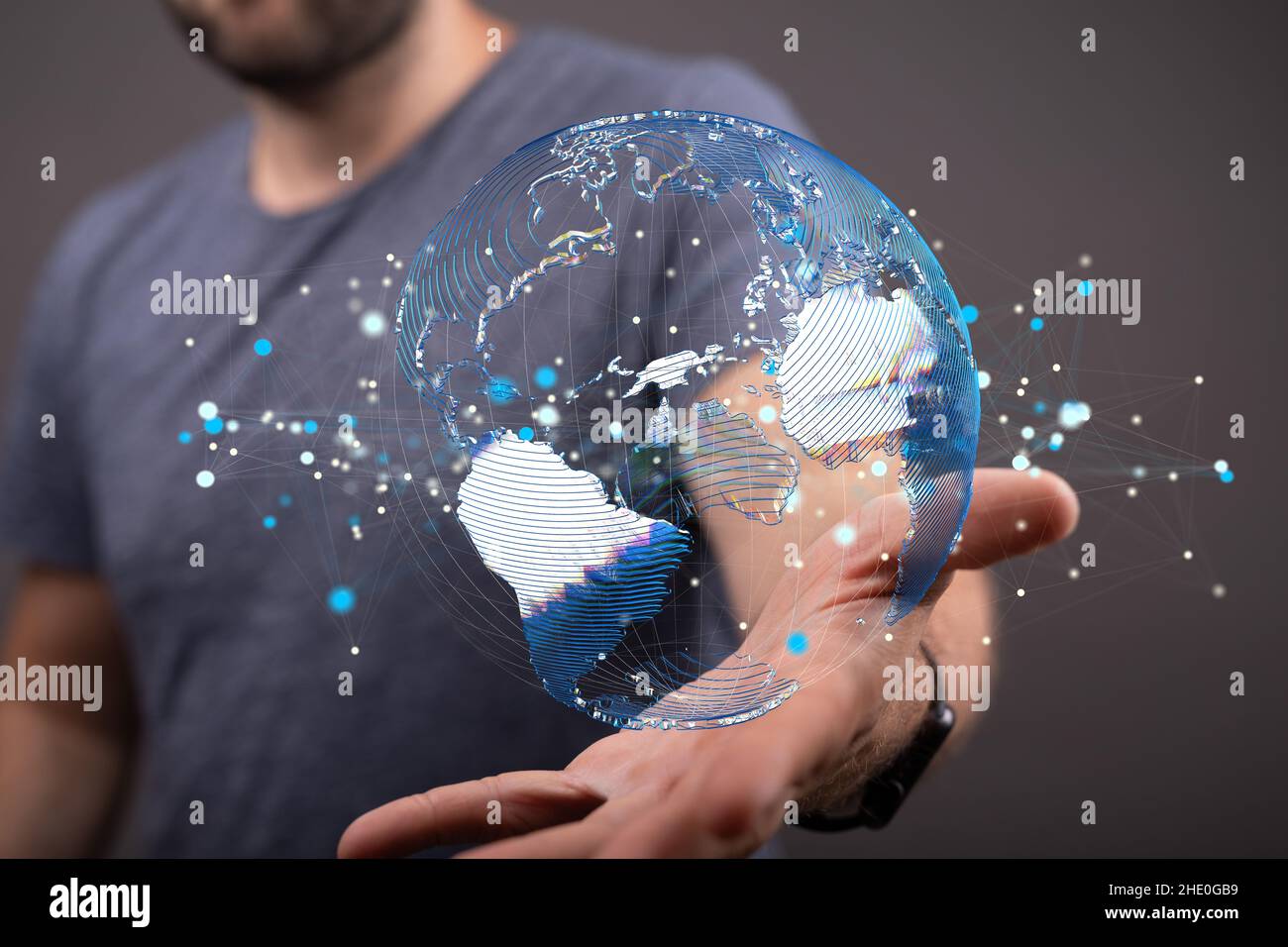 Closeup shot of a man showing the global network on the globe Stock ...